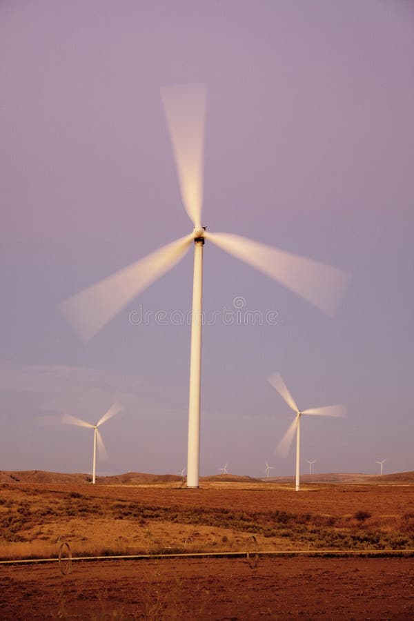 Windmill Wind Turbine Spinning in Wind at Sunset or Sunrise Stock Image ...