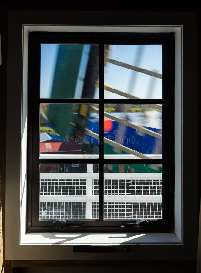 Old Windmill through Window in Fortress Wall Stock Image - Image of ...