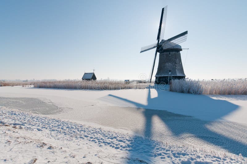 Windmill in winter scenery stock image. Image of polder - 23420707