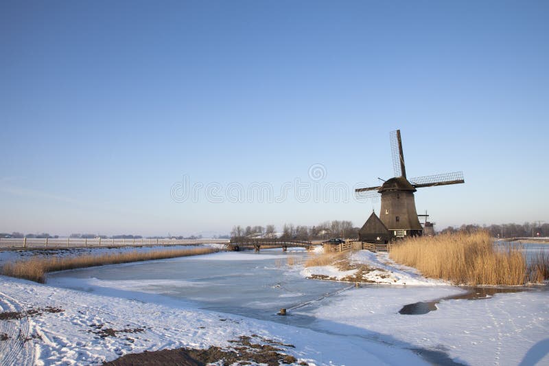 Windmill in the Snow stock photo. Image of farm, agriculture - 139962106