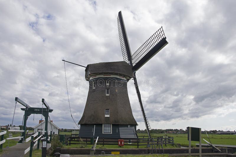 Windmill and wooden bridge stock photo. Image of energy - 75821274