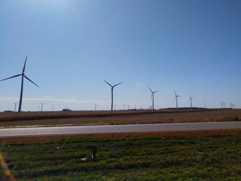 Windmills Along the Highway Stock Photo - Image of highway, green ...