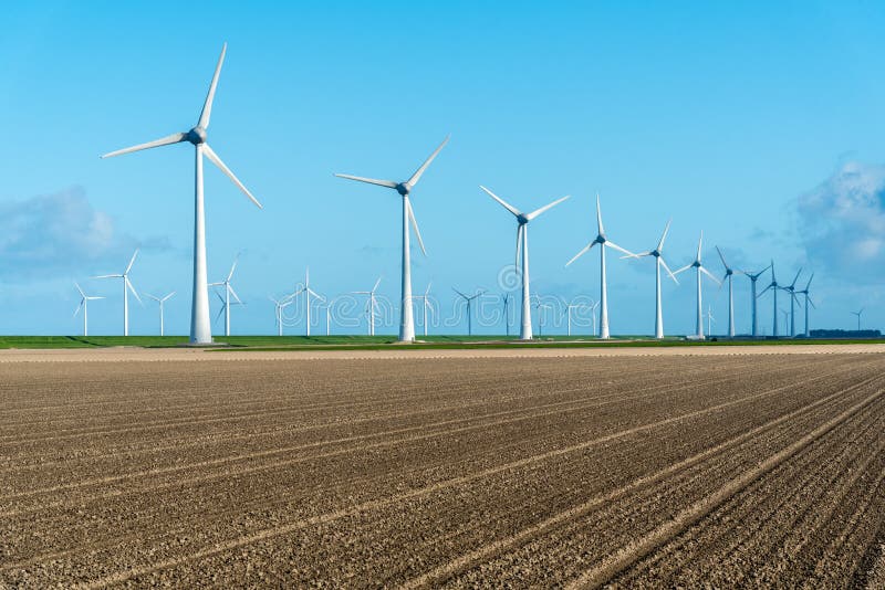 Windmills on the field stock photo. Image of energy, innovation - 98700948