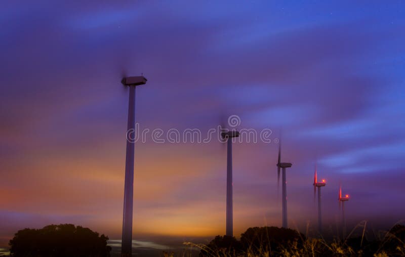 Windmills at night stock photo. Image of group, efficiency - 34045754