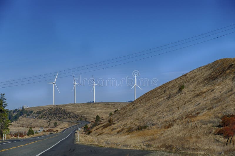 Windmills and Power Lines on Hills Stock Image - Image of power, high ...