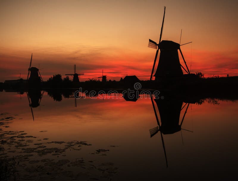 Windmills at Sunset in Holland Stock Photo - Image of rural, holland ...