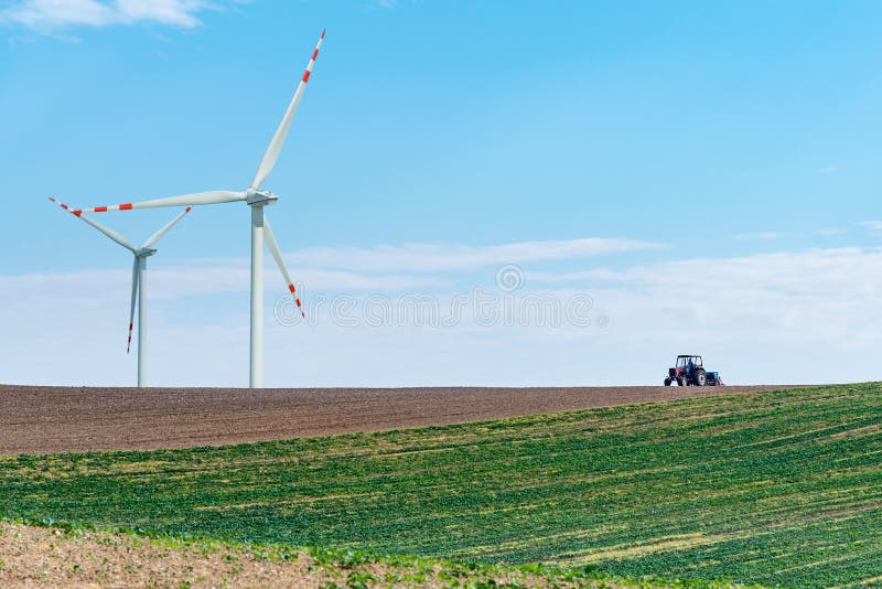 Windmills and Tractor on the Field Stock Image - Image of harrow ...