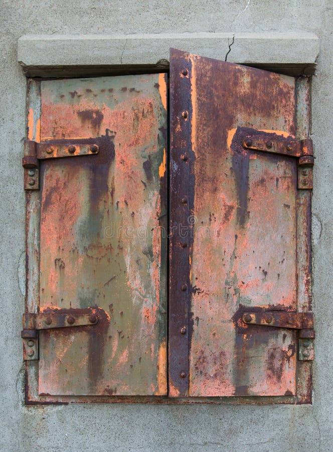 Window of an Abandoned Building with Rusty Iron Shutters Stock Photo ...