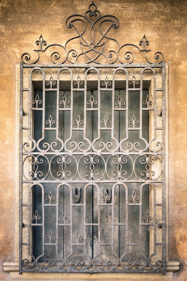 Window of an Ancient Italian Villa with Artistic Iron Grill. Stock ...