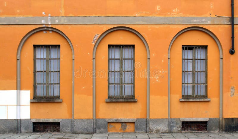 Window Bars and Closed Windows on an Orange Wall Stock Photo - Image of ...