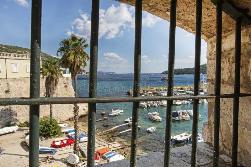 Window with Bars of an Old Fortress Overlooking the Port. Stock Photo ...