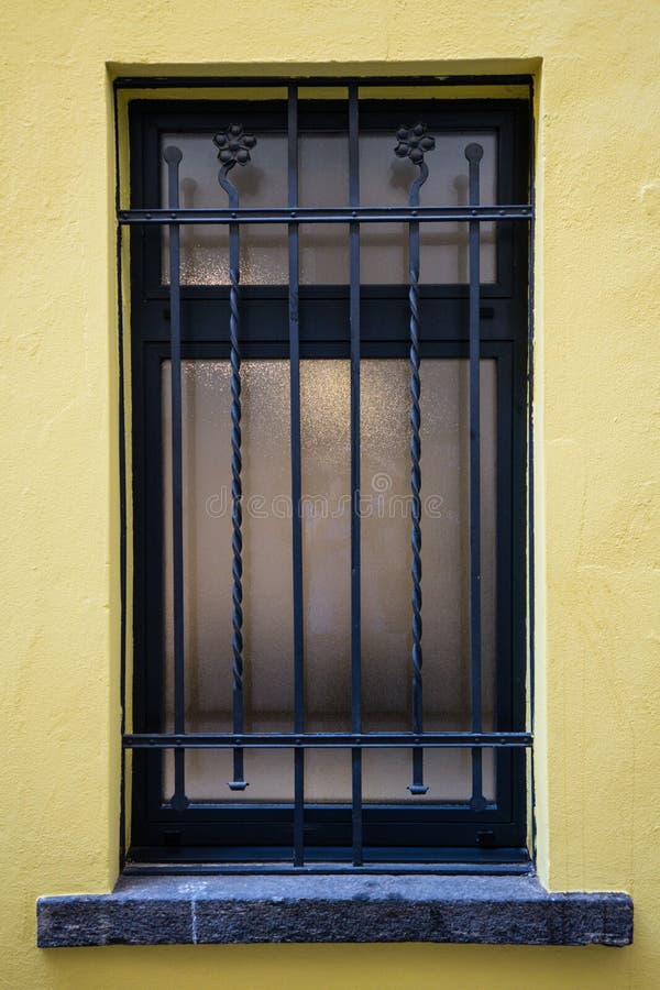 Window with Black Gate and Yellow Wall Stock Image - Image of gate ...