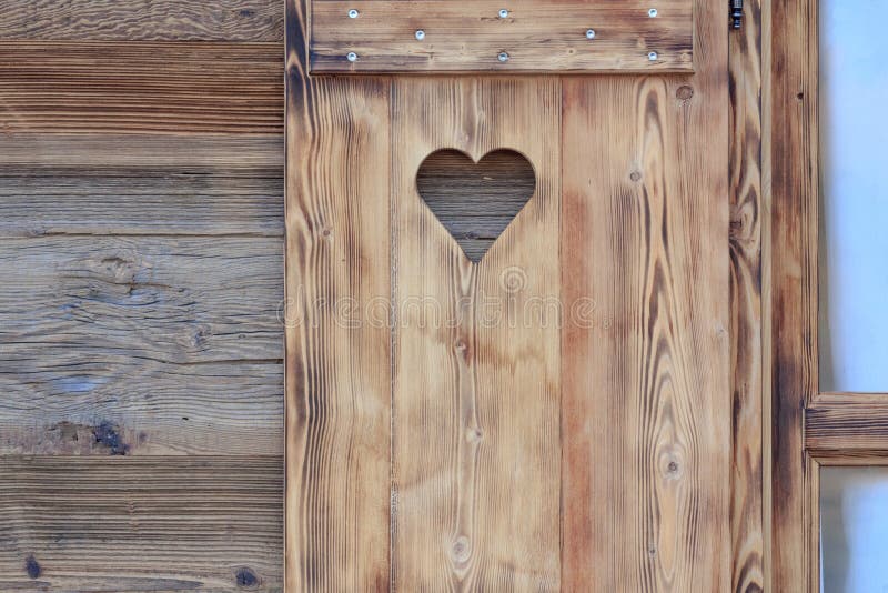Window Blind of a Wooden Hut with a Heart Shaped Hole Stock Photo ...