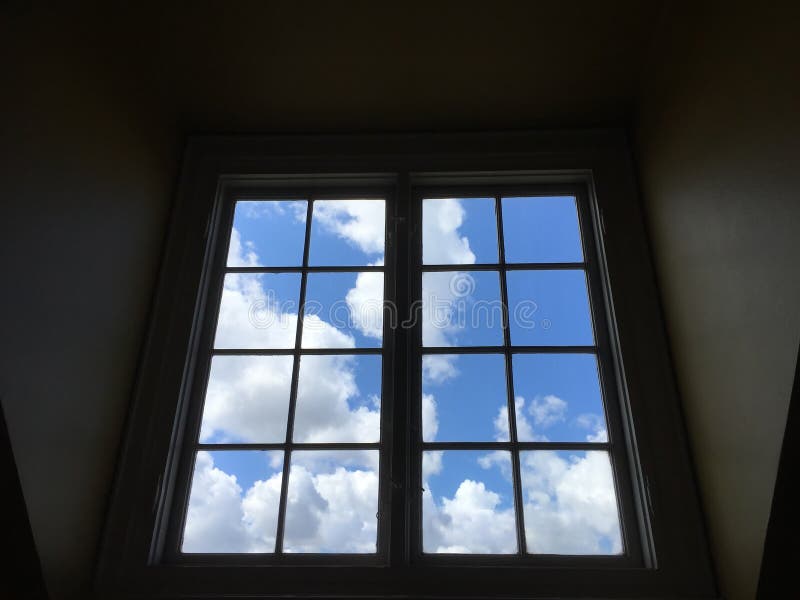 Window with blue skies stock photo. Image of window - 111494172