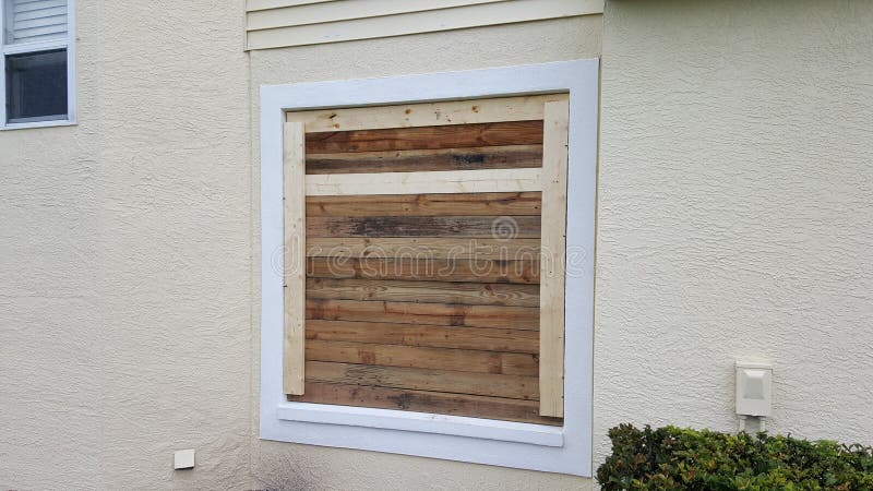 Window Boarded Up after House Fire with it`s Roof and Eves Charred ...