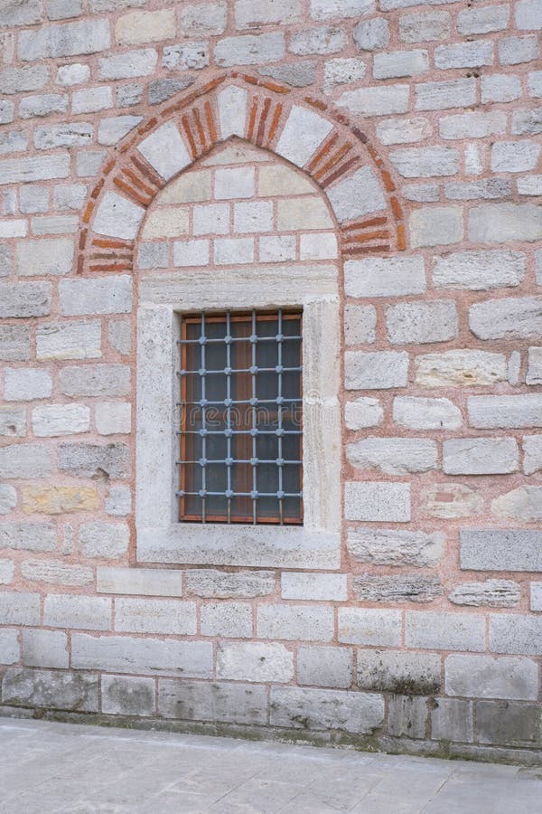 Window on a Brick Wall Under Brick Arch Stock Photo - Image of orange ...