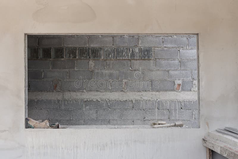 Window on Cement Wall with Brick Wall Background in Construction Stock ...