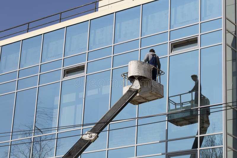 Window Cleaner on a High-rise Building. Window Washing with the Help of ...