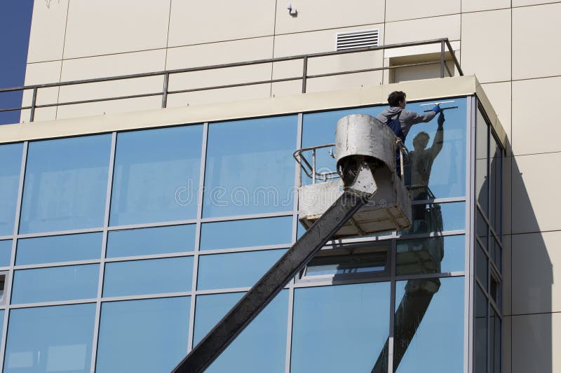 Window Cleaner on a High-rise Building. Window Washing with the Help of ...