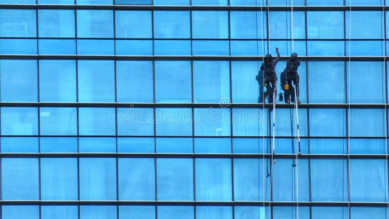 Window Cleaner at Work on the Skyscraper Editorial Photo - Image of ...