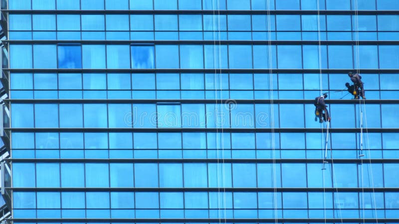 Window Cleaner at Work on the Skyscraper Editorial Photo - Image of ...