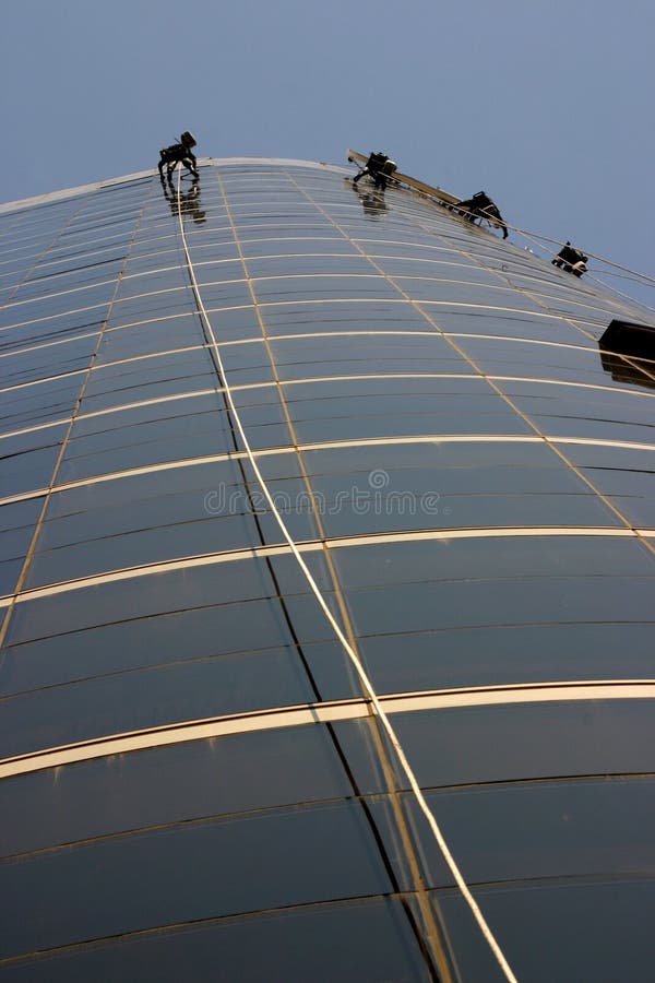 Window Cleaners Dangling from a Rope Stock Image - Image of rope, risk ...