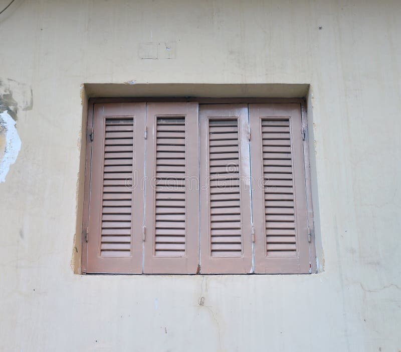 Window Closed Shutters on the Wall of a House Stock Image - Image of ...