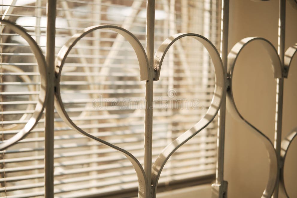 Window with a Decorative Lattice with Patterns in Evening Sun. Stock ...