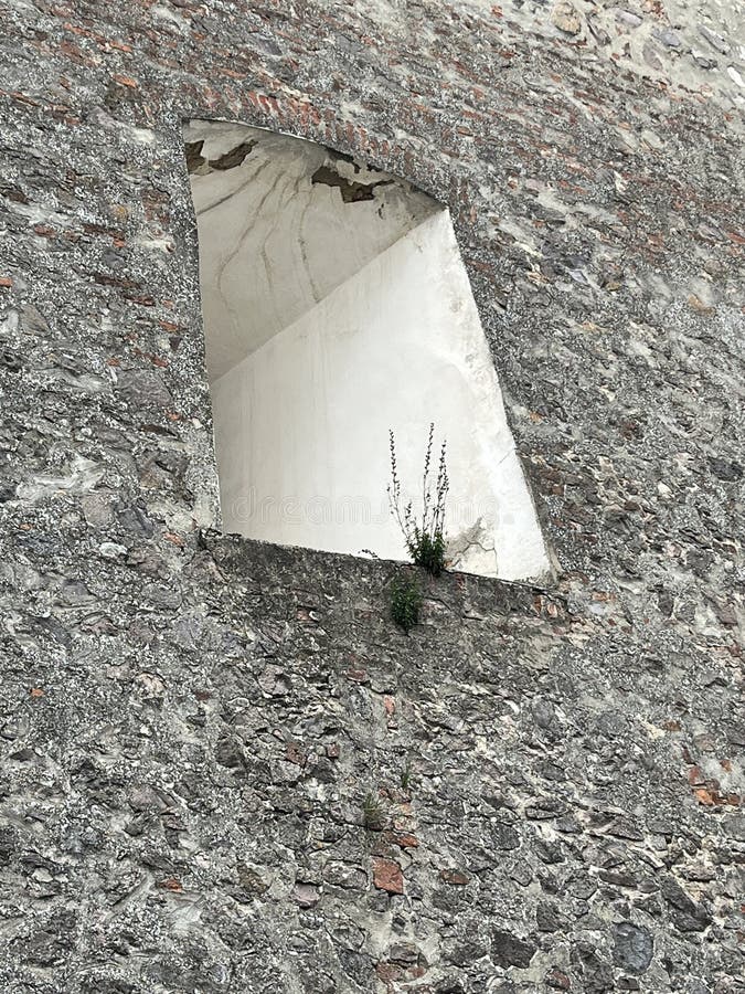Window in the Deep Stone Wall of an Ancient Fortress. Background with ...