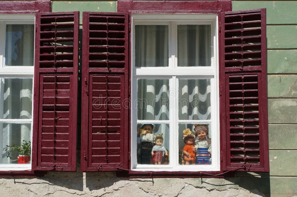 Window with dolls stock image. Image of curtain, white - 33445609