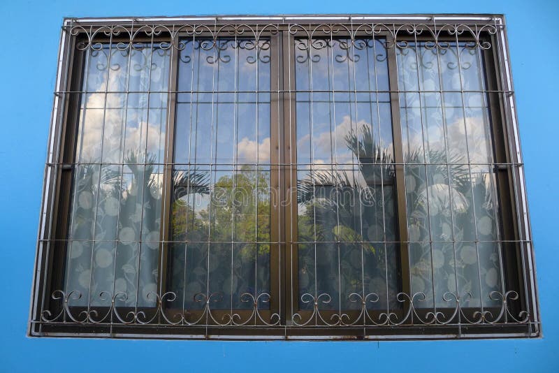 Window and Fence in One of the Houses in the Land of Open Shutters ...