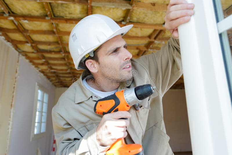 Window Fitter Holding Cordless Drill Stock Photo - Image of glazier ...