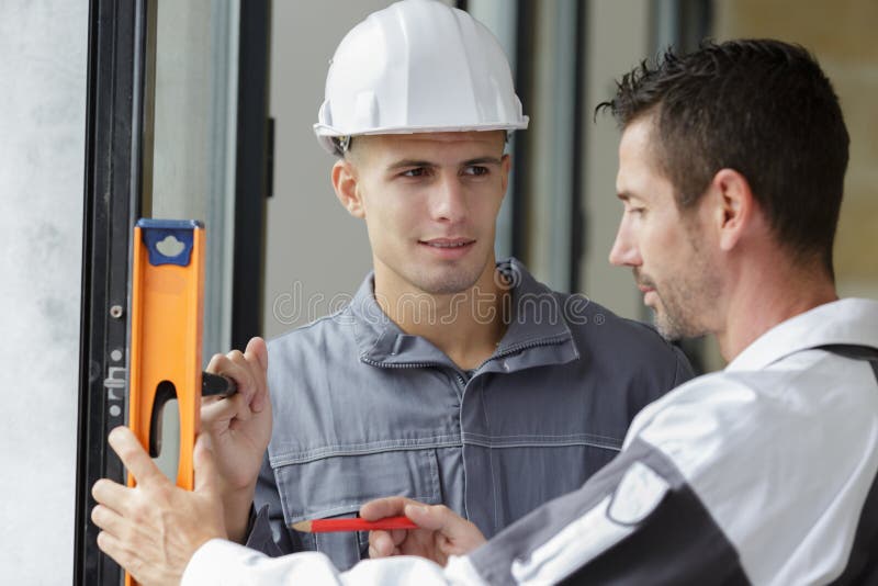 Window Fitting Team Using Spirit Level Stock Photo - Image of glazier ...