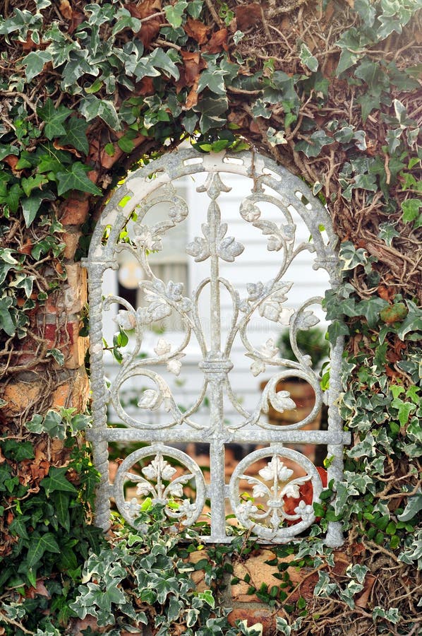Window in garden fence stock image. Image of antique - 43614009