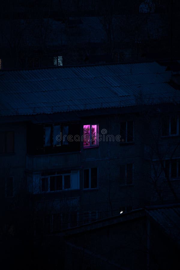 The Window Glows Red in the House at Night Stock Image - Image of ...