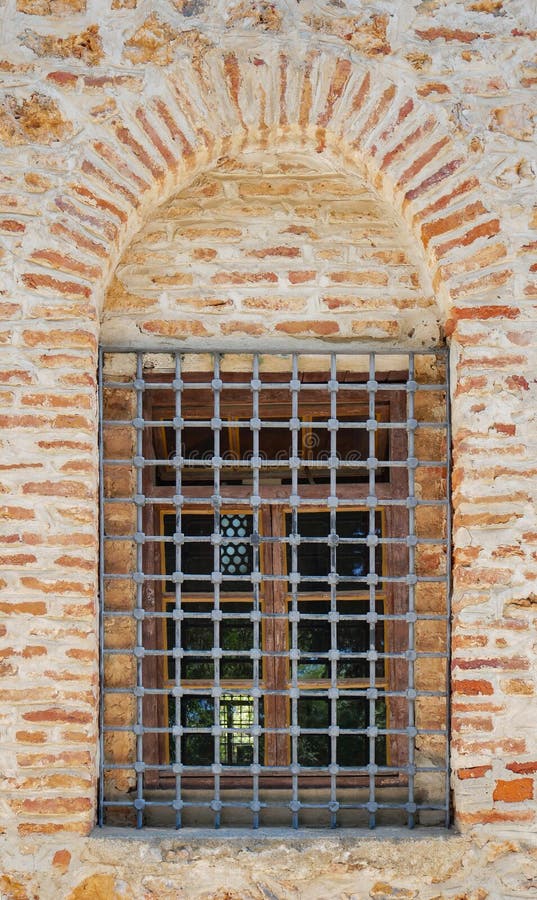 Window with a Grid on the Facade in an Antique Brick Old Building Stock ...