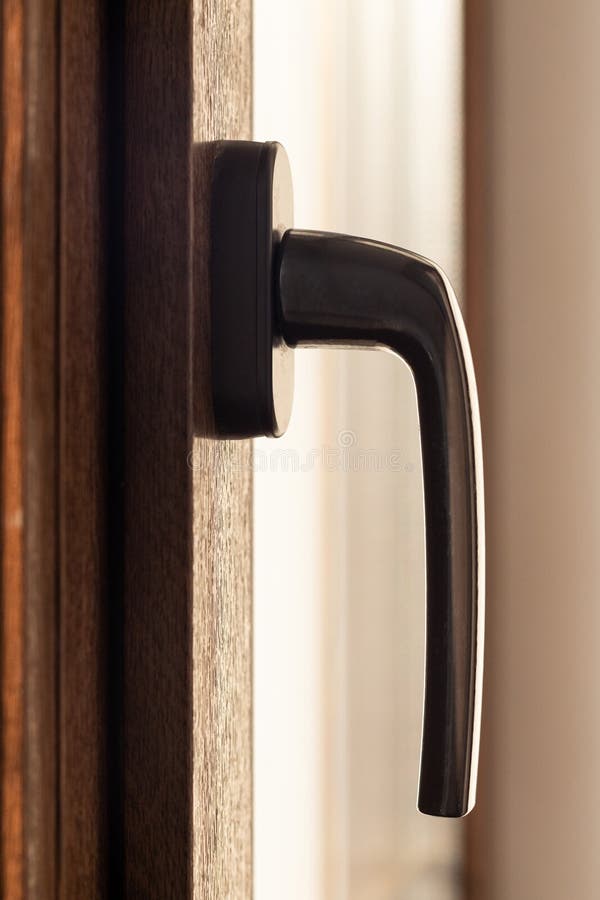 Window Handle on a Brown Metal-plastic Window, Side View, Vertical ...