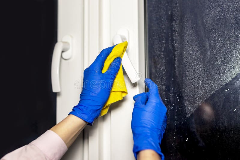 Window Handles Cleaning or Sanitizing with Sanitizer at Night Stock ...