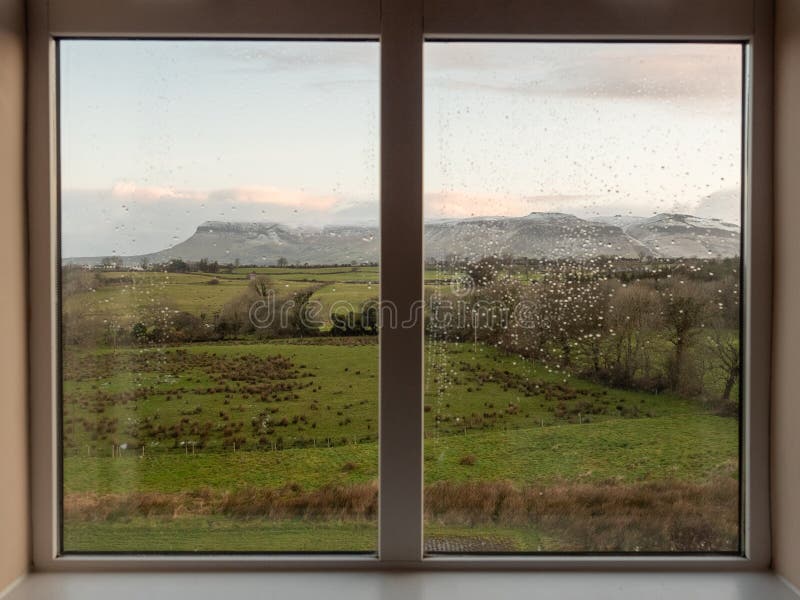 Window in a House with Beautiful Scenery with Green Fields and ...