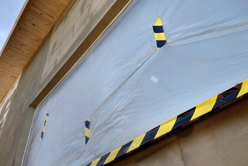 Window of a House Under Construction Covered with Protective Plastic ...