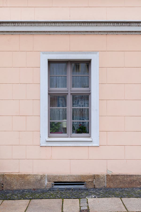 A window on a house wall stock image. Image of design - 84348865