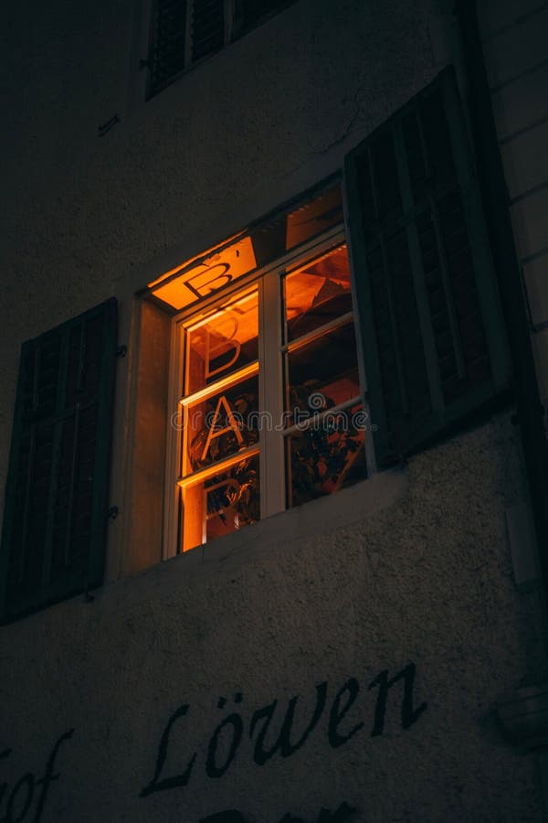 A Window Illuminated by the Lights Inside Stock Photo - Image of window ...