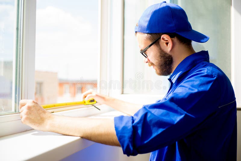 Window installation worker stock photo. Image of person - 98085662