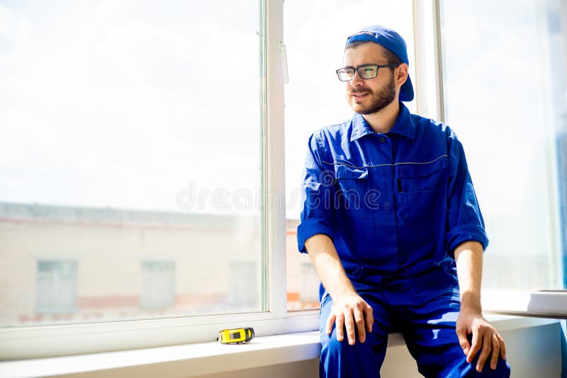 Window installation worker stock image. Image of industry - 98085807