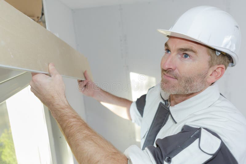 Window Installer Putting Board on Top Stock Image - Image of profession ...