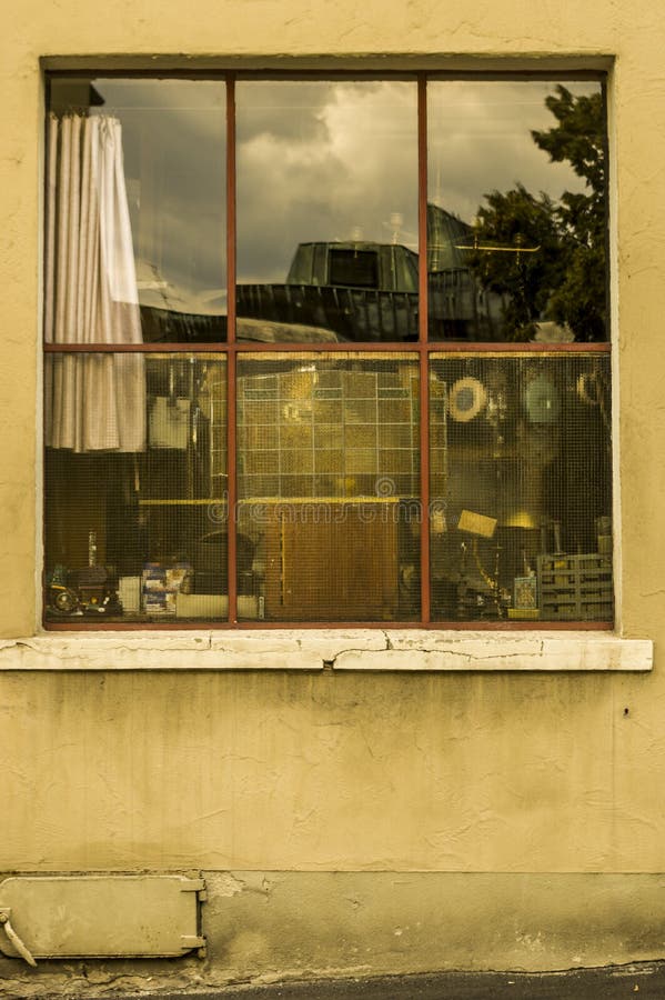 Window of a Junk Shop with Reflection in a Dilapidated Facade Stock ...