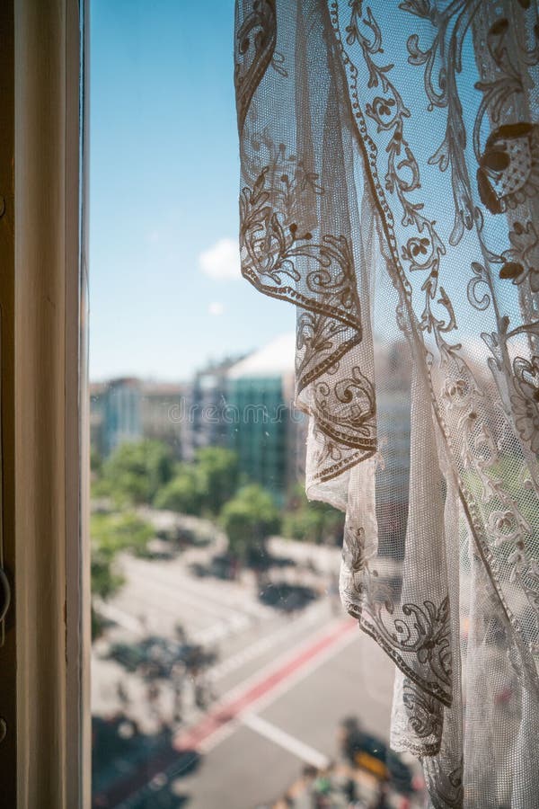 Window with Lace Curtain and Cityscapes Outside the Window Stock Photo ...
