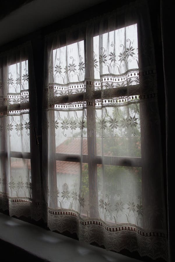 The Window with Lace Grating and Delicate Tulle is Light Yellow-pink in ...