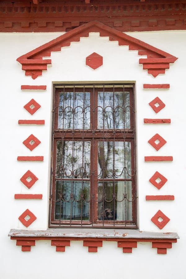 A Window with a Lattice Framed by a Beautiful Pattern of Bricks on the ...