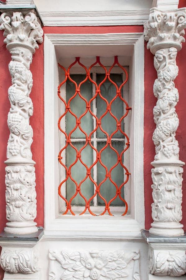 A Window in a Lattice between Two Symmetrical Columns Stock Image ...